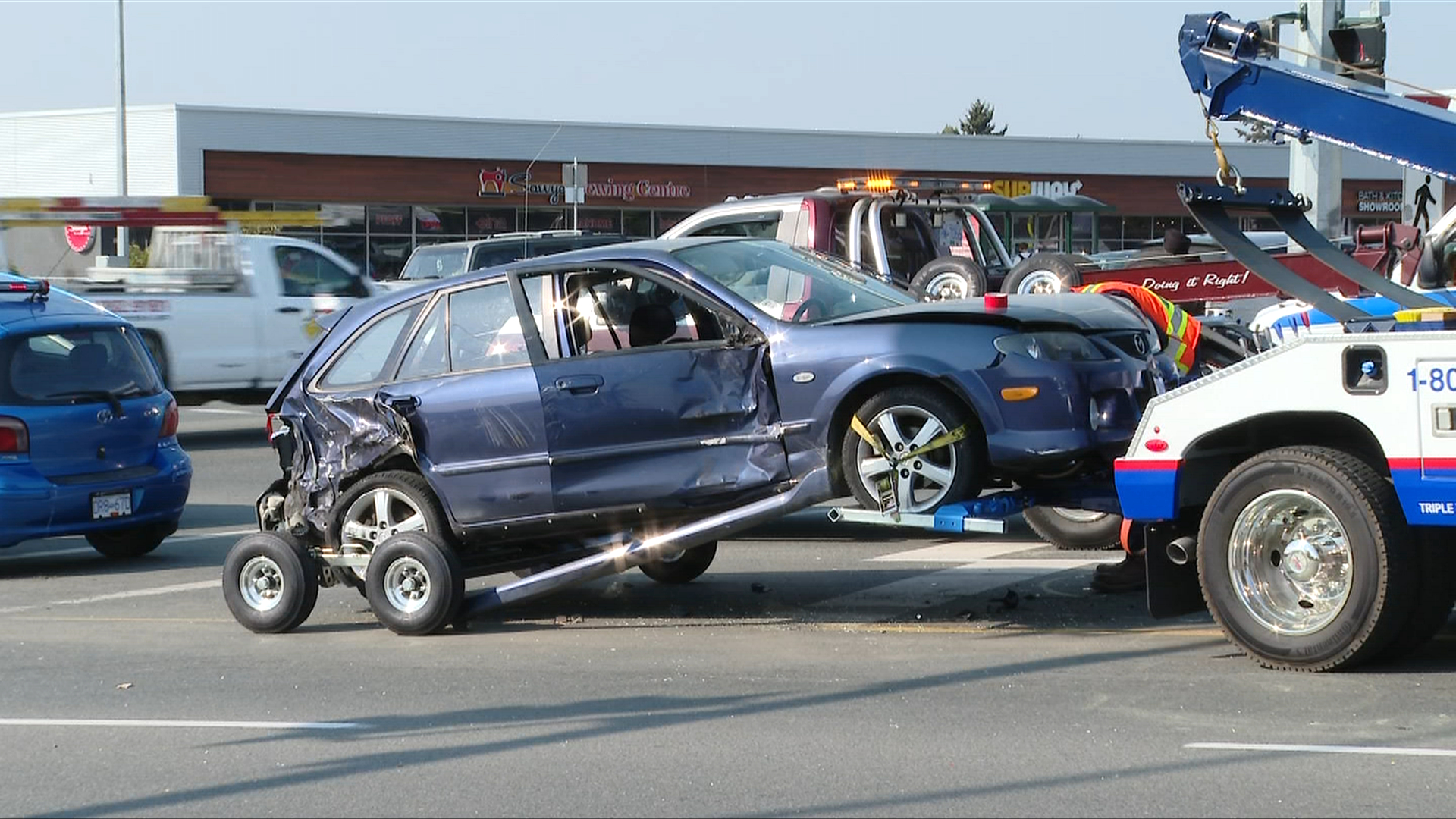 No serious injuries in four-vehicle crash after car gets stuck under ...