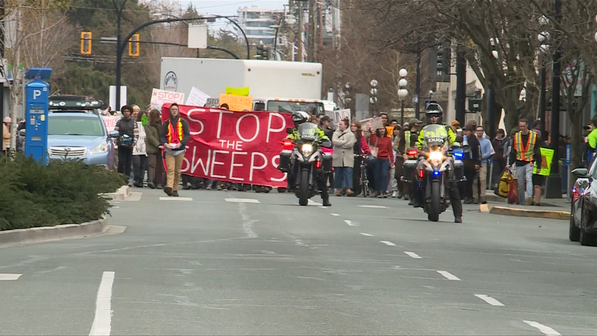 Around 100 people protest Victoria's enforcement of sheltering bylaws